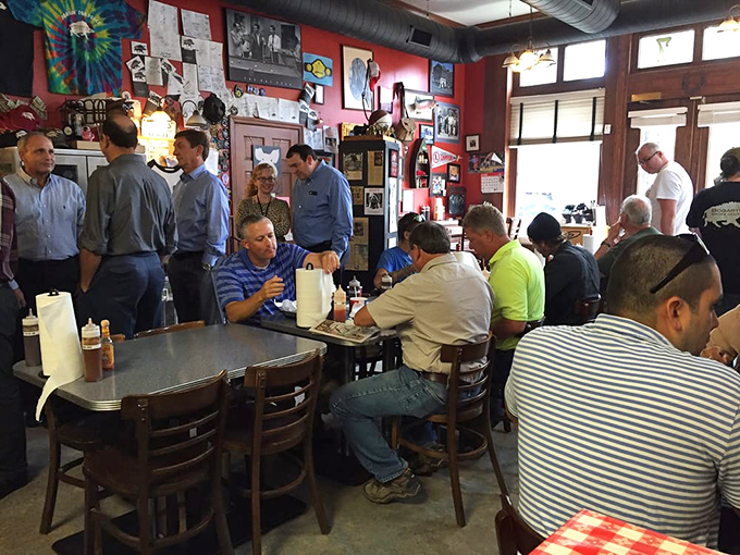 The universal language of barbecue brings strangers together. That focused silence? It's the sound of serious eating happening.