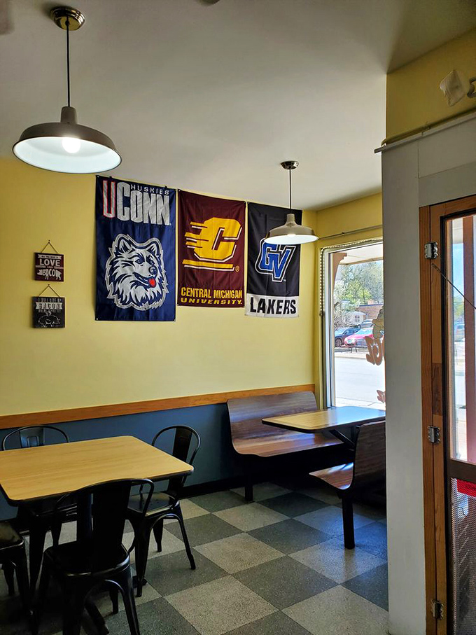 College pennants and simple wooden booths create that perfect "hometown joint" atmosphere where memories are made between bites of creative comfort food.