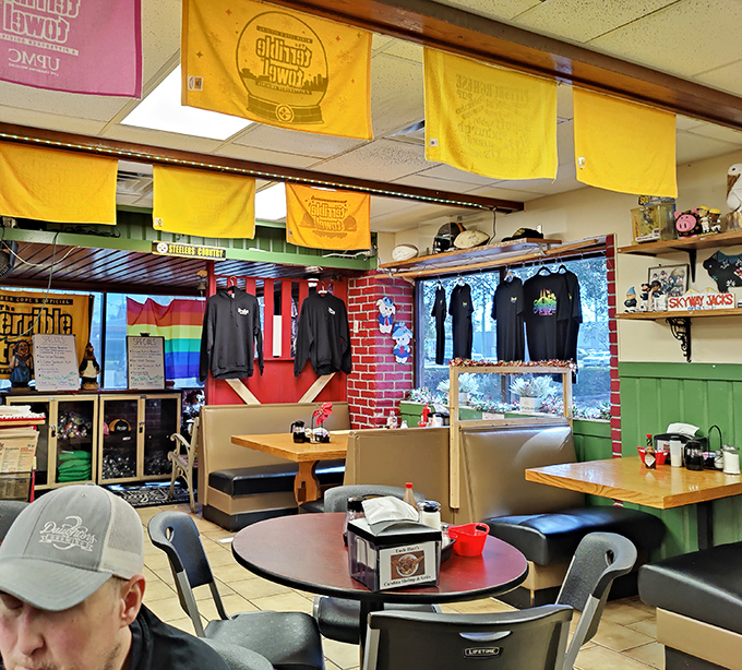 Yellow banners hang like breakfast battle flags, declaring this territory a sanctuary for those who worship at the altar of comfort food.