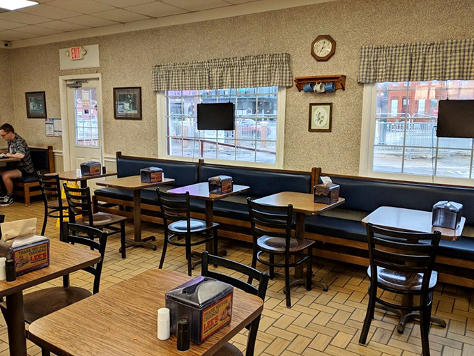 The dining room where strangers become friends united by the universal language of "mmm" and occasional napkin emergencies.