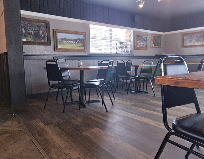 Simple chairs, wooden tables, and framed artwork create the perfect backdrop for food that needs no fancy setting to shine.