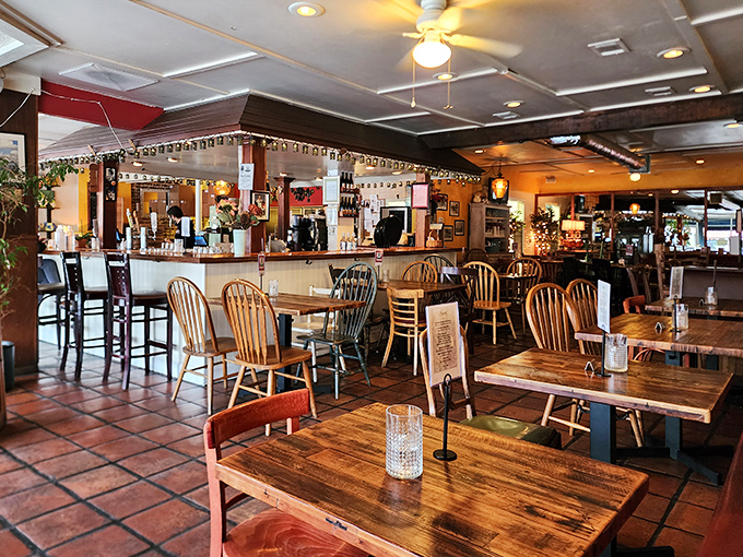 Wooden tables, warm lighting, and terra cotta floors create the perfect backdrop for the main event&mdash;that pizza you're still thinking about days later.