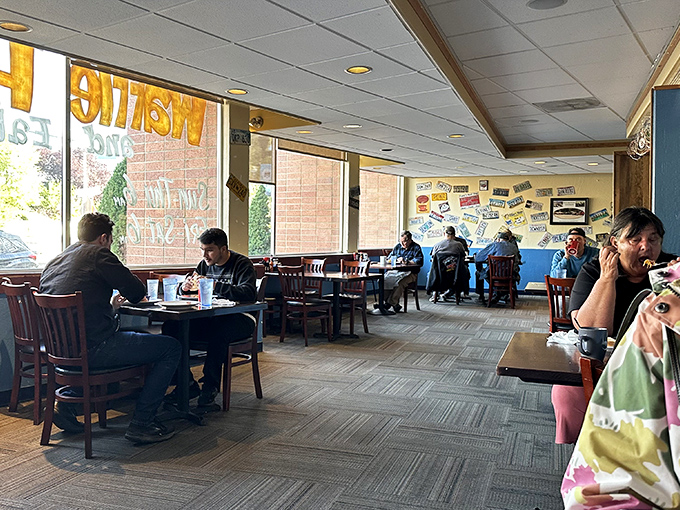 Morning light streams through windows, illuminating a dining room where strangers become neighbors, united by the universal language of exceptional breakfast.