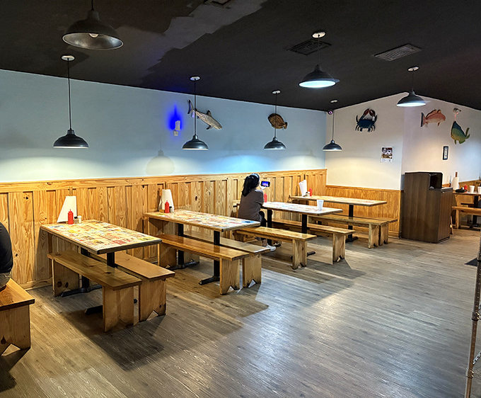 No designer chairs or mood lighting, just honest wooden benches and the soft glow of pendant lights illuminating seafood feasts.