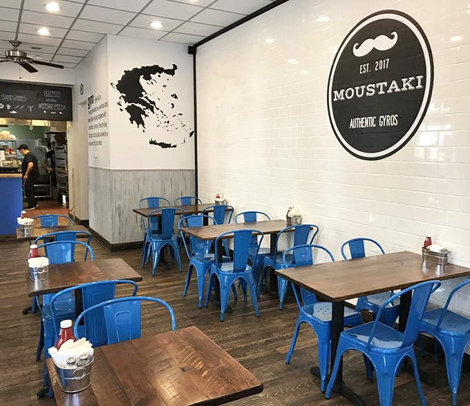 The silhouette of Greece adorning the wall reminds you this isn't just dinner&mdash;it's a culinary passport to the Mediterranean.