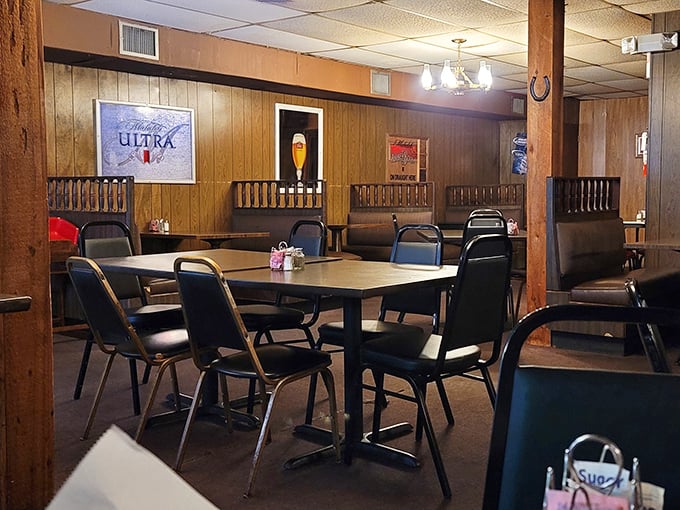 No-nonsense seating in a room where beer signs serve as art&mdash;because when the steaks are this good, who needs fancy chandeliers?