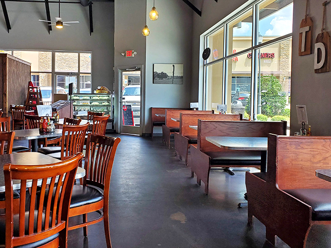 Sun-drenched dining area where wooden booths wait patiently for the next round of hungry Texans seeking comfort food salvation.