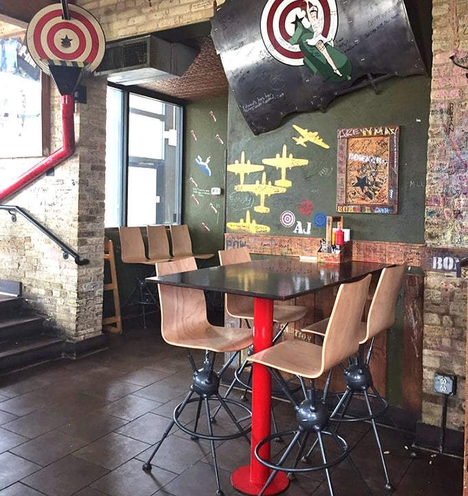 Aviation-themed touches adorn the walls while model planes stand ready to deploy&mdash;this isn't just d&eacute;cor, it's dinner theater for your burger experience.