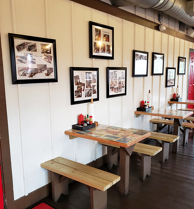 Photos on the wall tell stories of fishing adventures past, while simple wooden tables await the next round of seafood enthusiasts. Nautical minimalism at its finest.