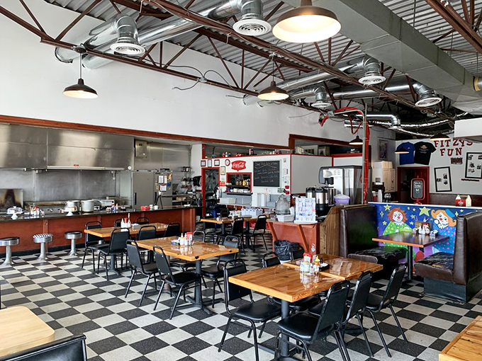 The dining room buzzes with that perfect diner energy where strangers become friends over coffee.