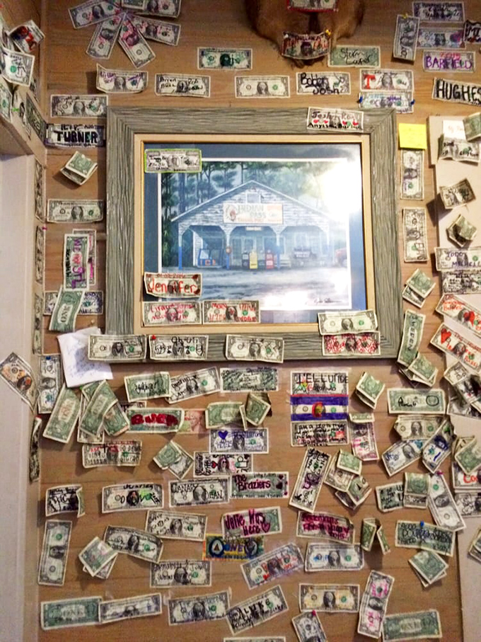 Dollar bills covering the walls tell stories of visitors past—a DIY decor approach that's worth more than its face value in character.