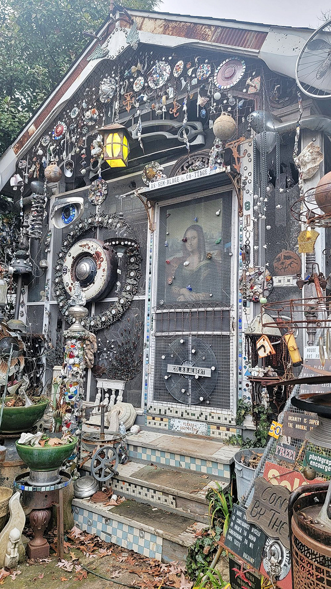 The entrance feels like stepping through a portal to another dimension where every doorbell probably plays a different Tom Waits song.