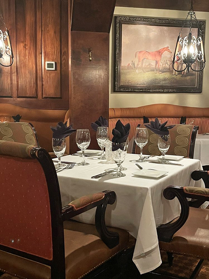 Equestrian artwork and warm lighting create an atmosphere where every meal feels like celebration.