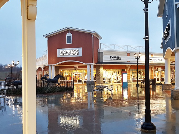 Even in the rain, Express Factory Outlet's barn-red facade glows with promise, beckoning shoppers to dash through puddles for fashion finds.