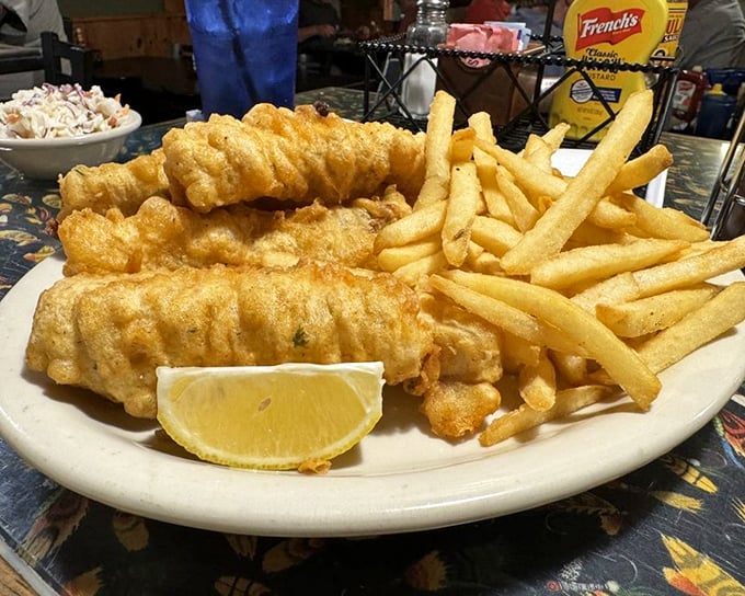 Fish so perfectly fried it makes you wonder if the chef has some secret pact with the cooking gods. The fries aren't bad either.