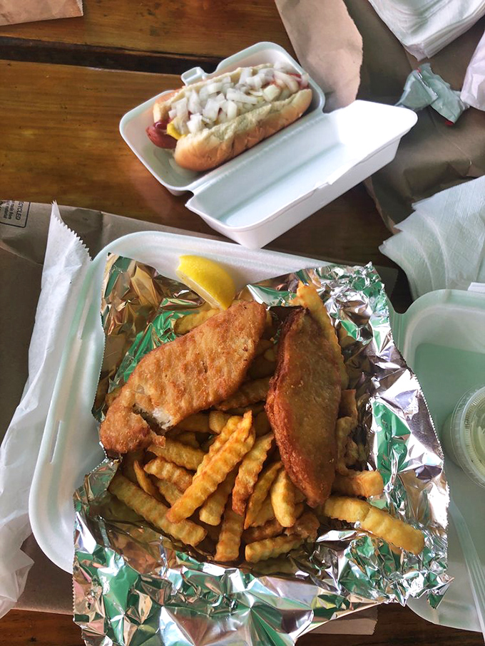 Fish and chips meets hot dog heaven on one tray. The foil wrapper isn't just packaging&mdash;it's containing a flavor explosion.
