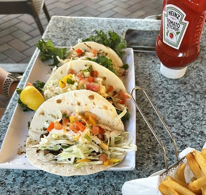 Fish tacos that bring the ocean to your tortilla. Fresh, vibrant, and topped with enough colorful ingredients to make a rainbow jealous.