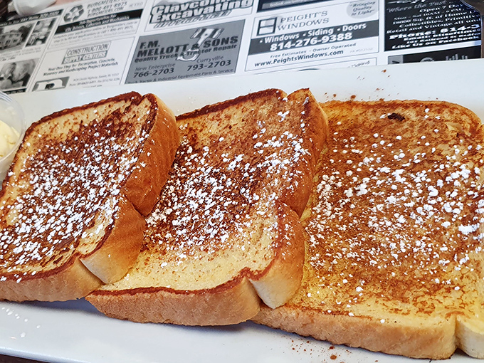 French toast dusted with powdered sugar like a light Pennsylvania snowfall &ndash; simple breakfast perfection that makes you wonder why anyone needs avocado toast.