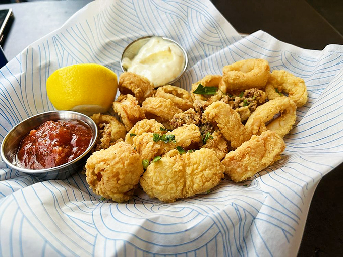 Fried calamari so perfectly golden, it deserves its own trophy. The kind of dish that makes sharing feel like a personal sacrifice.