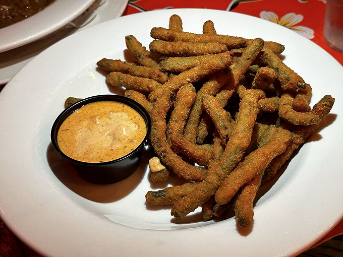 These aren't your average green beans &ndash; they're vegetables that went to finishing school, got a crispy makeover, and returned with a tangy dipping sauce companion.