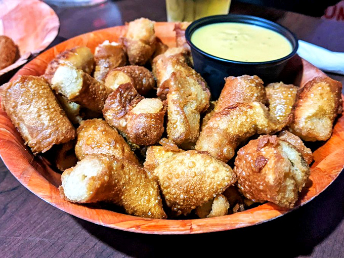 Pretzel bites that have achieved their highest purpose in life: golden-brown perfection with a side of honey mustard enlightenment.