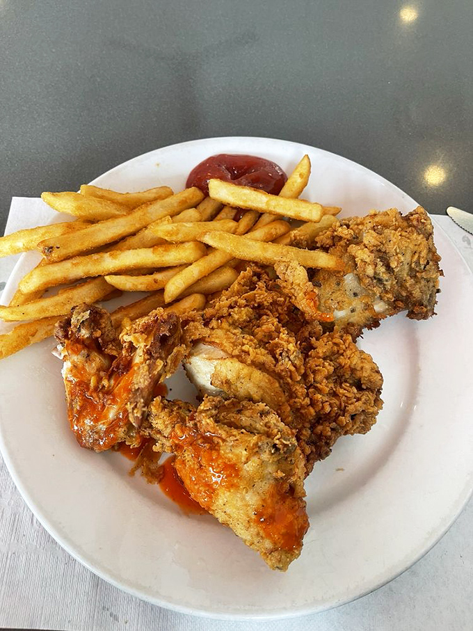 Fried chicken that crackles with each bite, paired with golden fries—comfort food that speaks a universal language of deliciousness.