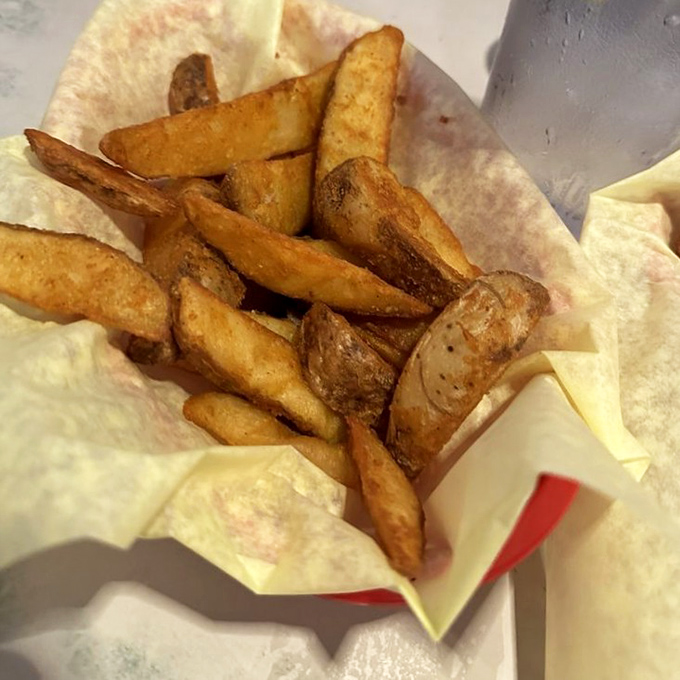 These aren't just fries—they're golden potato soldiers standing at attention, ready to be dipped into ketchup, shakes, or straight into your mouth.
