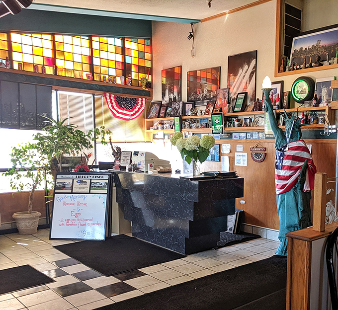 The front desk area, where stained glass meets patriotism, and the daily specials board makes promises it fully intends to keep.