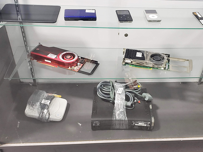 Behind glass, computer components wait for tech-savvy shoppers. These silicon survivors might power someone's first gaming rig or home office setup.