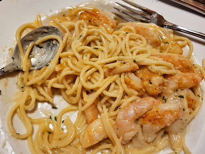 Garlic shrimp pasta that twirls perfectly around your fork, leaving you contemplating whether it's appropriate to lick the plate in public.