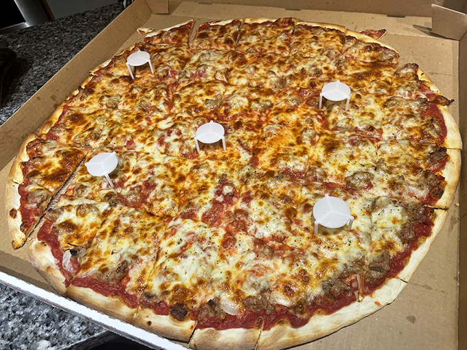Behold, the Giant Pizza—a legendary pie big enough to feed a softball team or one very determined individual with weekend plans.