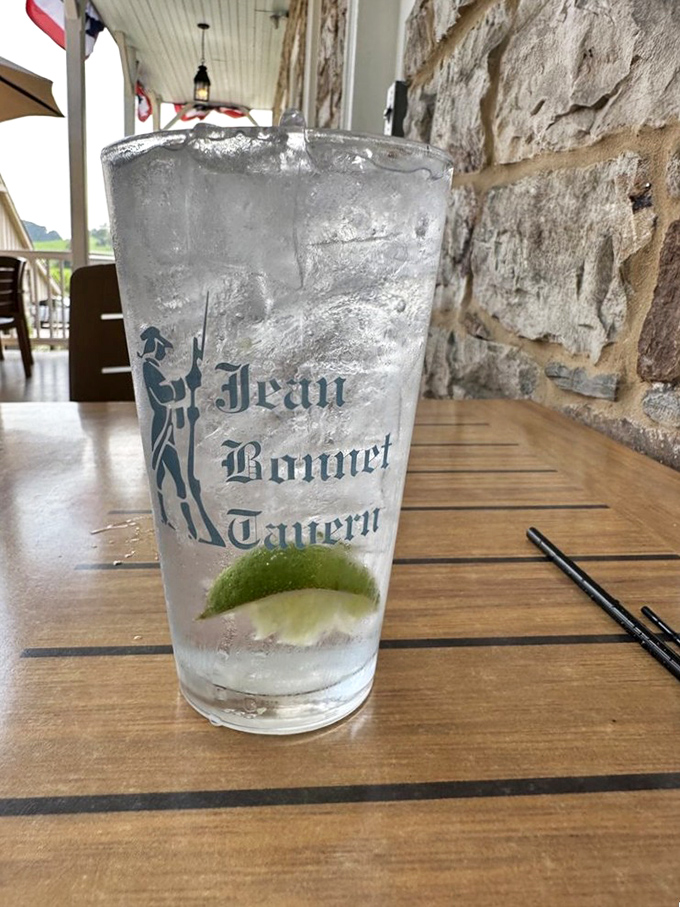 A perfectly poured gin and tonic, complete with lime and tavern logo. Simple pleasures become extraordinary when enjoyed against centuries-old limestone.