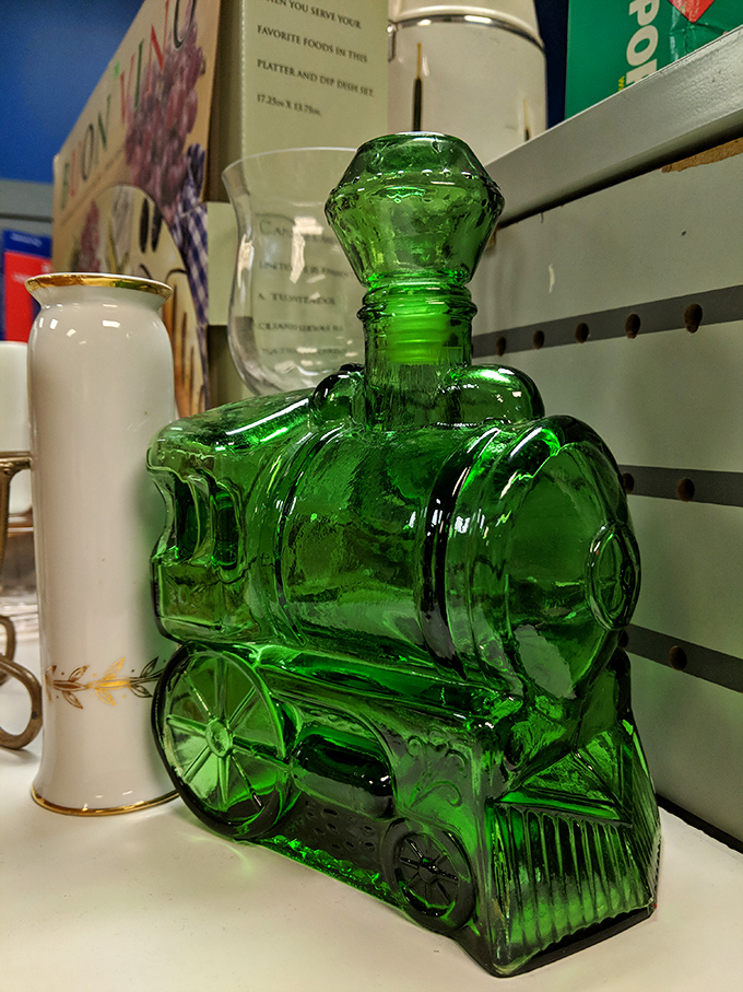 This emerald green glass train isn't just a decorative bottle&mdash;it's the conversation starter your mantel has been desperately missing.