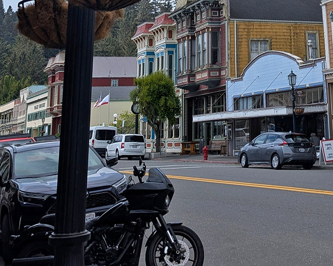 Main Street after dark transforms into a glowing gallery of Victorian silhouettes&mdash;Edward Hopper meets Disneyland's Main Street, minus the crowds.