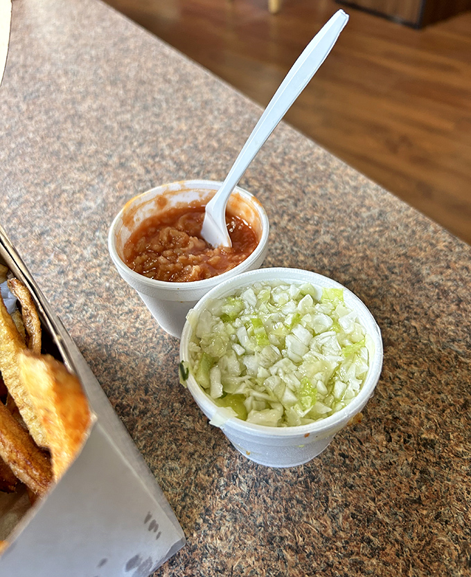 The perfect bite awaits assembly &ndash; crispy chicken, tangy slaw, and that famous hot sauce. A culinary handshake between Serbia and small-town Ohio.