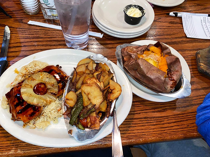 Hawaiian-inspired perfection: grilled meat with pineapple, rice, and vegetables that bring a tropical vacation to your taste buds.