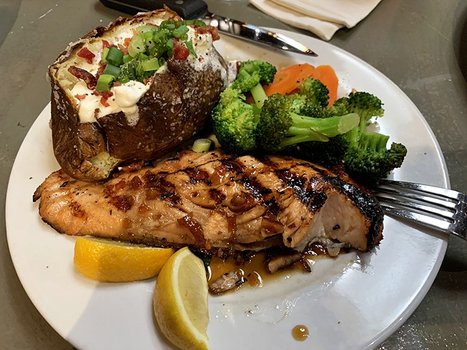 This grilled fish with its perfect char marks proves Tahoe Joe's isn't just about beef. The loaded baked potato alongside is playing a strong supporting role in this delicious drama.
