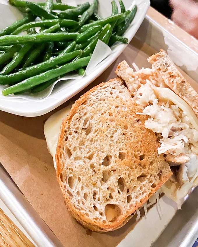The Grouper Reuben meets green beans in a plate partnership that proves seafood and vegetables can live happily ever after.