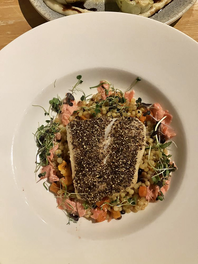 Ocean meets farm in this perfectly seared halibut resting on a bed of colorful grains&mdash;proof that steakhouses can master seafood too.