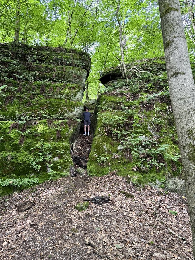 Some passages require a bit of childlike determination. This explorer demonstrates the proper technique: one part courage, two parts "I hope nobody's watching." 