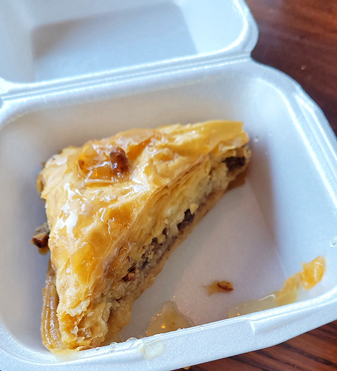Homemade baklava flaky enough to create its own weather system on your plate. Worth every crumb you'll be finding in your clothes later.