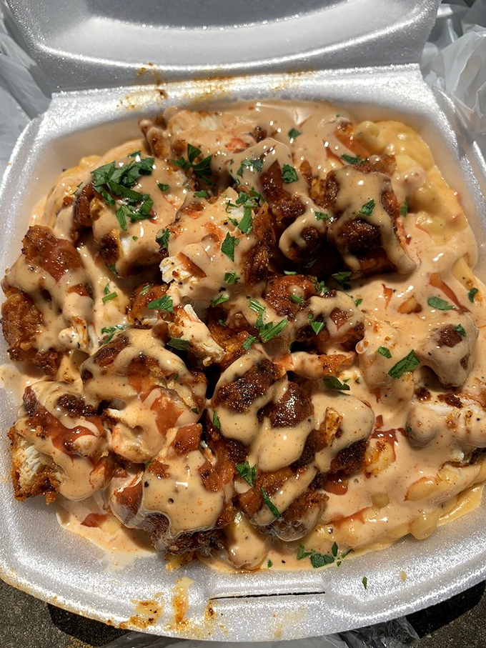 Hot chicken meets mac and cheese in a bowl that could solve international conflicts. The sprinkle of fresh herbs adds color to what is essentially comfort food perfection.