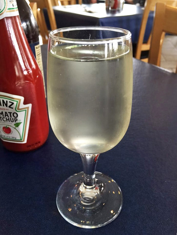 A glass of crisp Sauvignon Blanc waiting to complement your seafood feast. Wine and fish&mdash;a relationship that's stood the test of time.