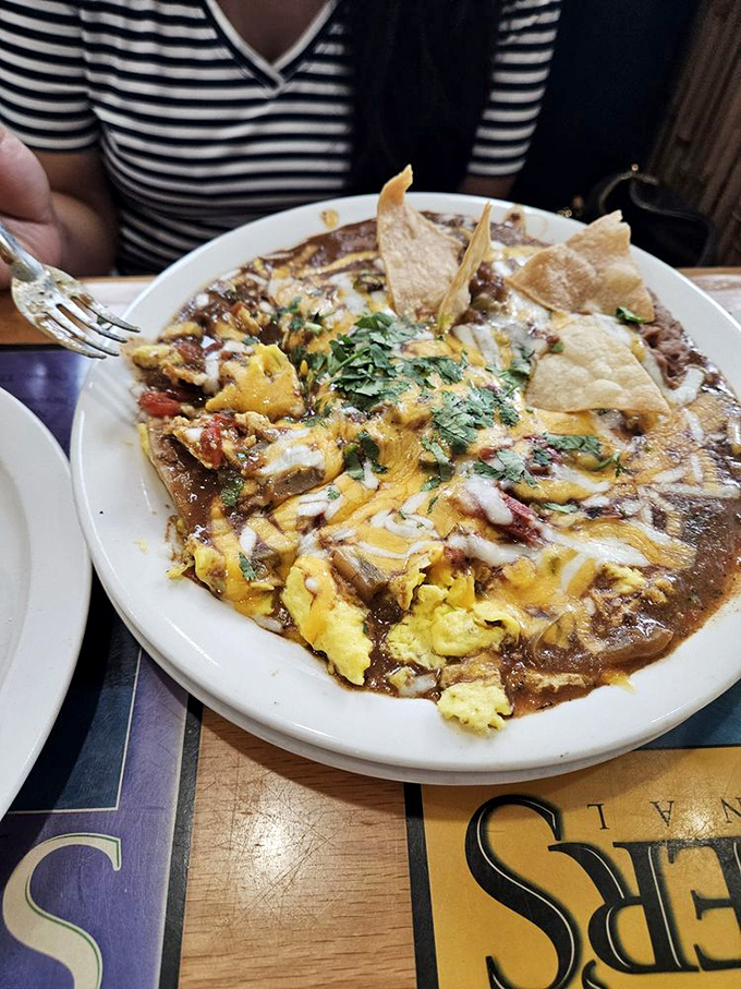 Huevos Rancheros reimagined as a colorful fiesta where eggs, tortillas, and ranchero sauce dance together in perfect harmony.