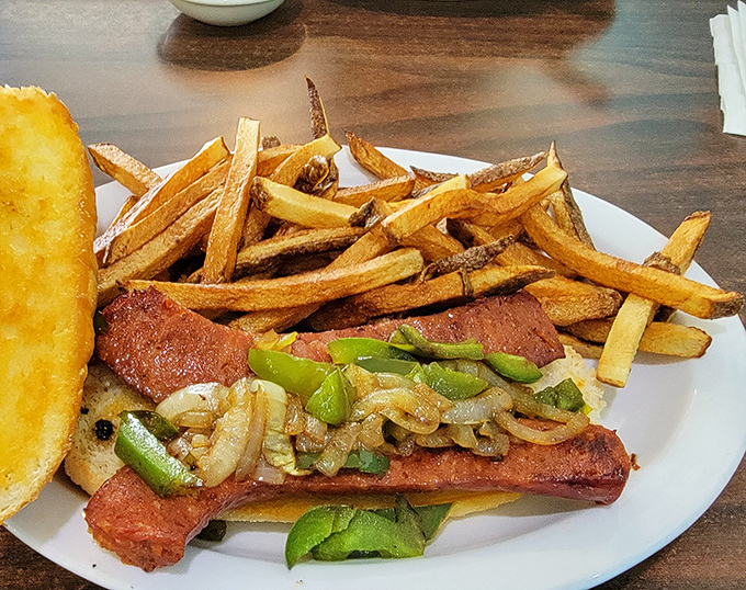 When a sandwich brings green peppers, onions, and perfectly grilled sausage together with hand-cut fries, conversation naturally pauses.