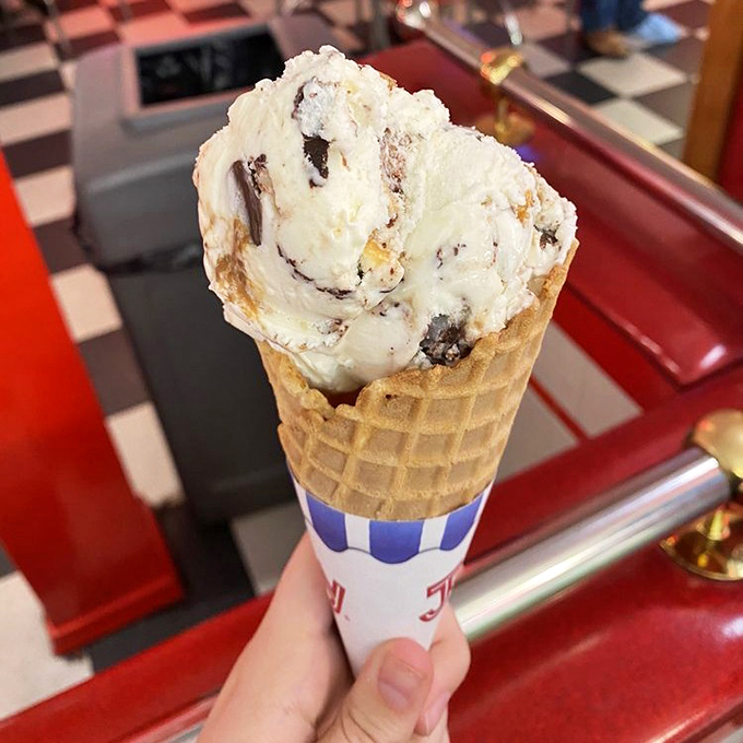 Waffle cones standing tall and proud, holding ice cream scoops the size of softballs because moderation is just a word in the dictionary.