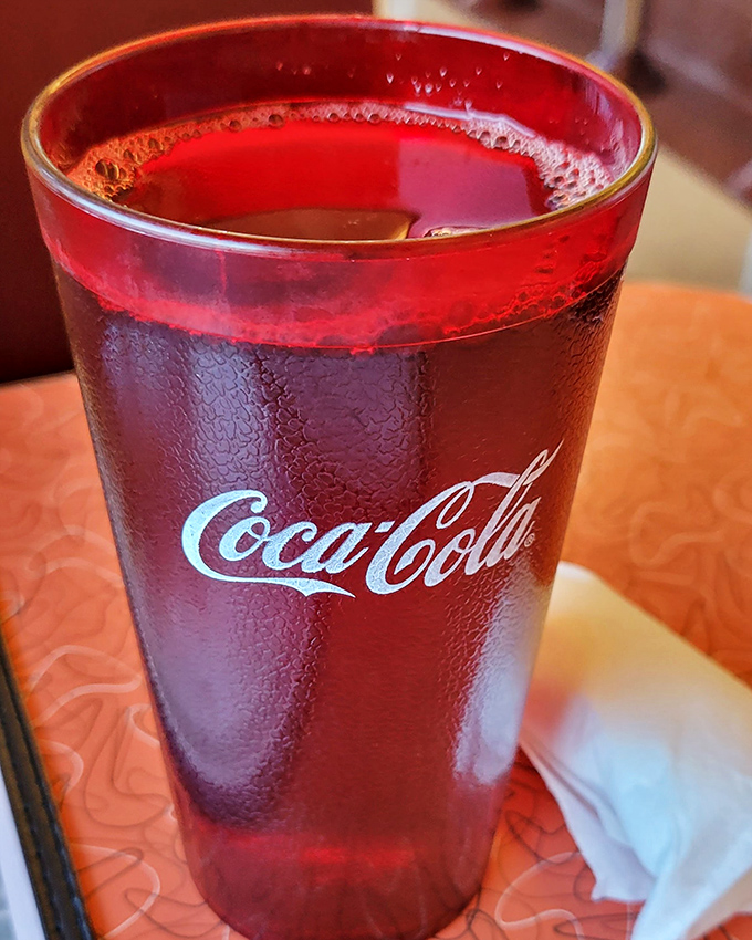 A classic Coca-Cola in a retro glass &ndash; sometimes the simplest pleasures are the most satisfying. Condensation beads promise refreshment.