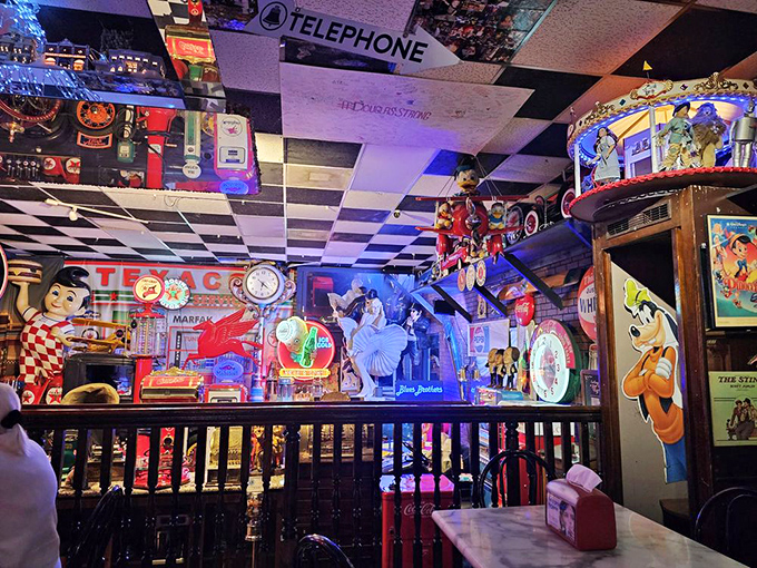 The ceiling and walls compete for your attention in this sensory wonderland. Every inch tells a story of American pop culture and sweet obsessions.