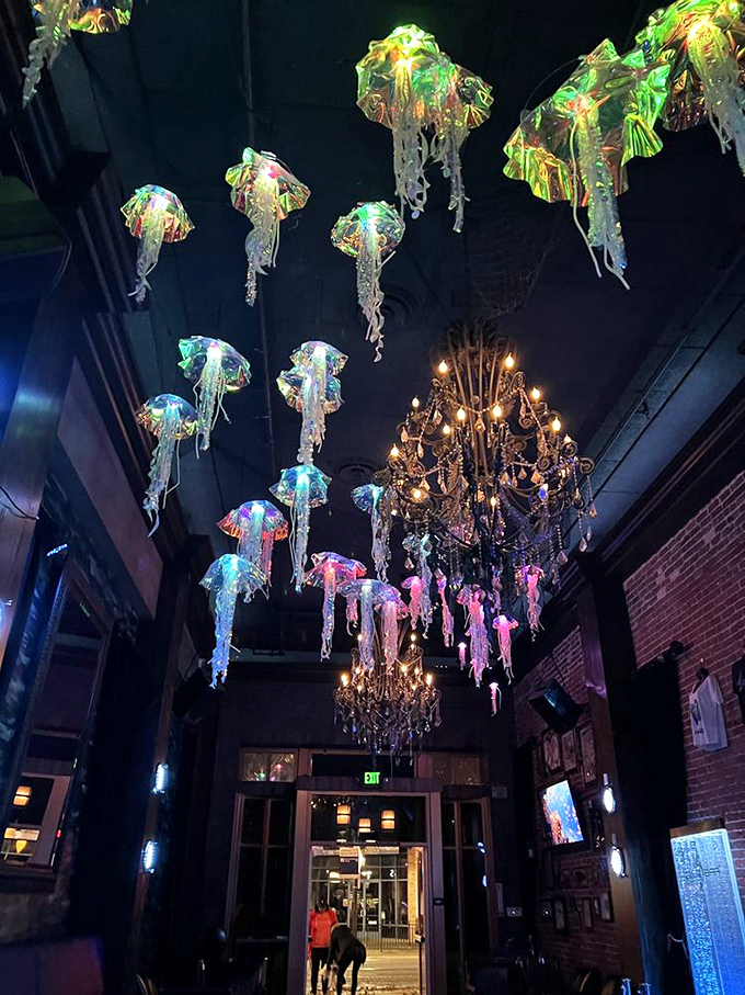 Illuminated jellyfish dance alongside a vintage chandelier &ndash; proof that Dive Bar's designers never got the memo about "less is more."