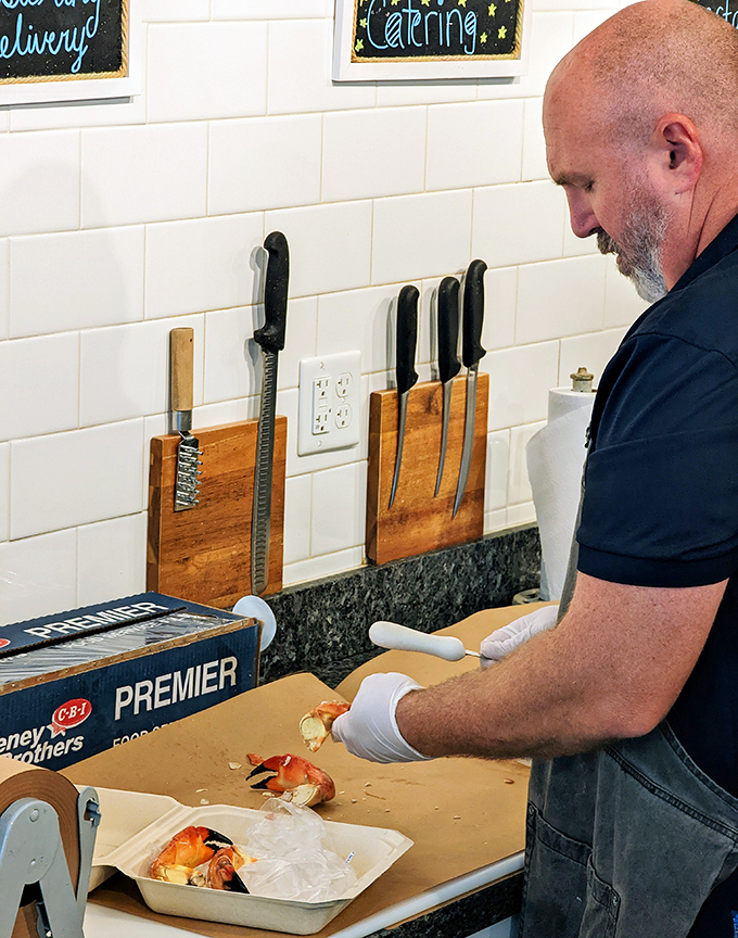 Craftsmanship in action. Watching skilled hands prepare seafood is like seeing a sculptor reveal what was always meant to be.